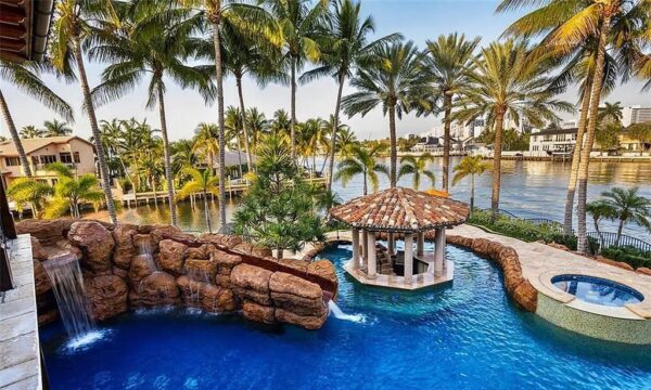 Palatial Palm Beac Inspired Mansion with 665 Feet of Wrap-Around Water ...
