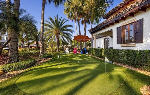 Palatial Palm Beac Inspired Mansion with 665 Feet of Wrap-Around Water ...
