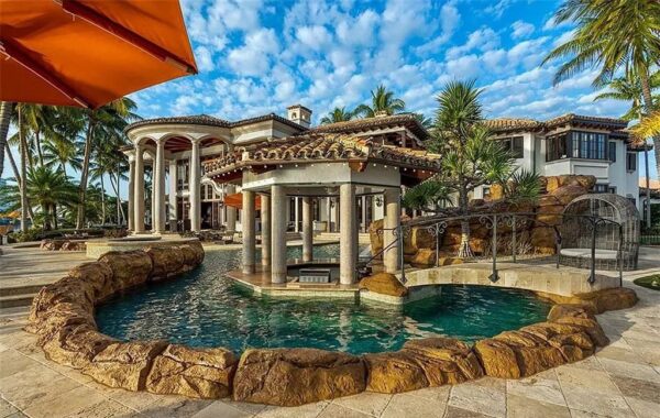 Palatial Palm Beac Inspired Mansion with 665 Feet of Wrap-Around Water ...
