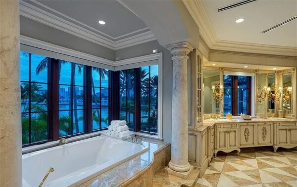 Palatial Palm Beac Inspired Mansion with 665 Feet of Wrap-Around Water ...