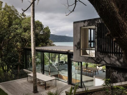 Mahuika House with spaces extend over the pool below by Daniel Marshall