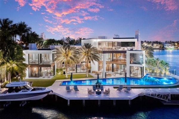 Opulent Waterfront Property with Expansive 90-Foot Lap Pool in Fort ...