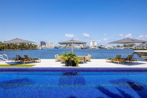 Opulent Waterfront Property with Expansive 90-Foot Lap Pool in Fort ...