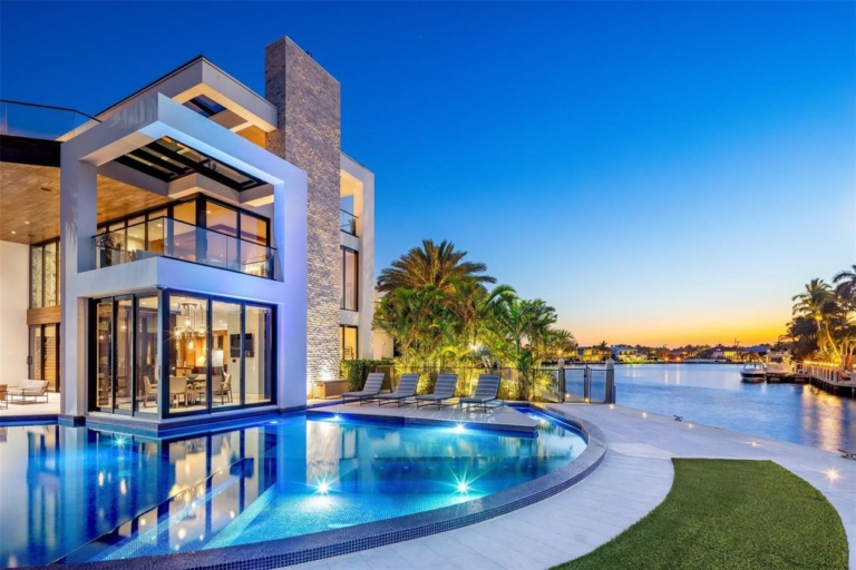 Opulent Waterfront Property with Expansive 90-Foot Lap Pool in Fort ...